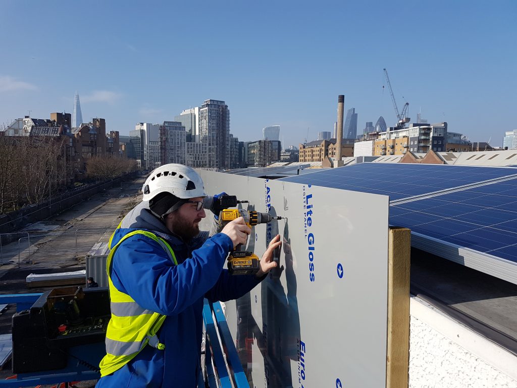 Portable cabin building wrap transforms temporary structure